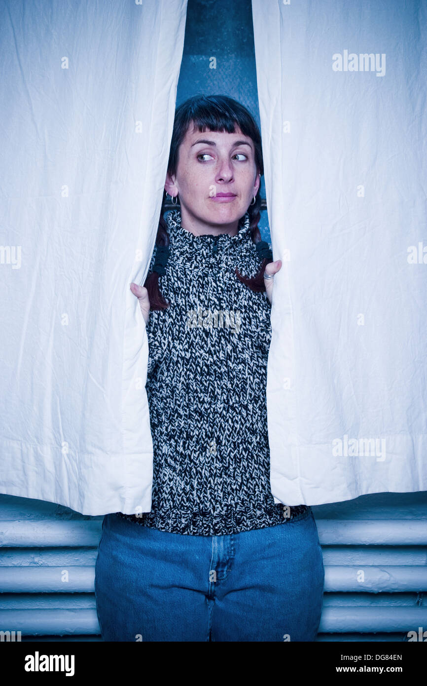 Peek from behind curtain hi-res stock photography and images - Alamy