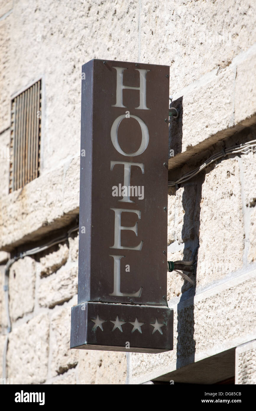 Hotel sign on the old wall Stock Photo - Alamy