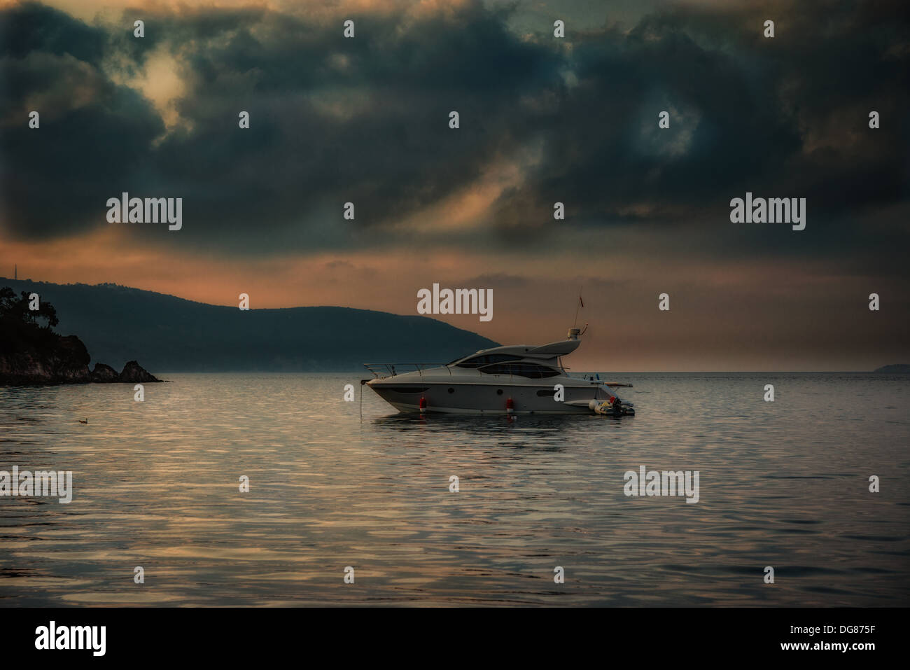 Lone boat orange sunset in hi-res stock photography and images - Alamy