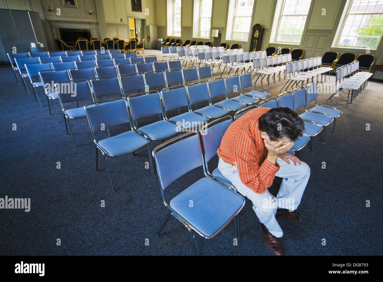 Man sitting alone in auditorium hi-res stock photography and images - Alamy