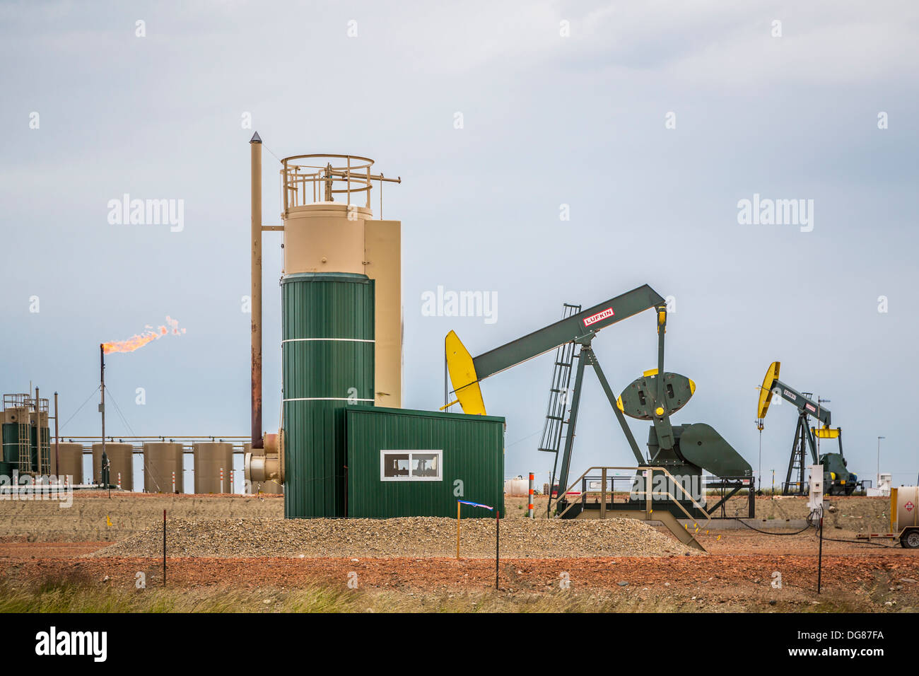 An oil pumper in the Bakken play oil fields near Williston, North ...