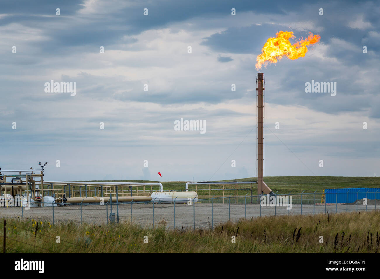 A flaring natural gas well in the Bakken play oil schale field near ...