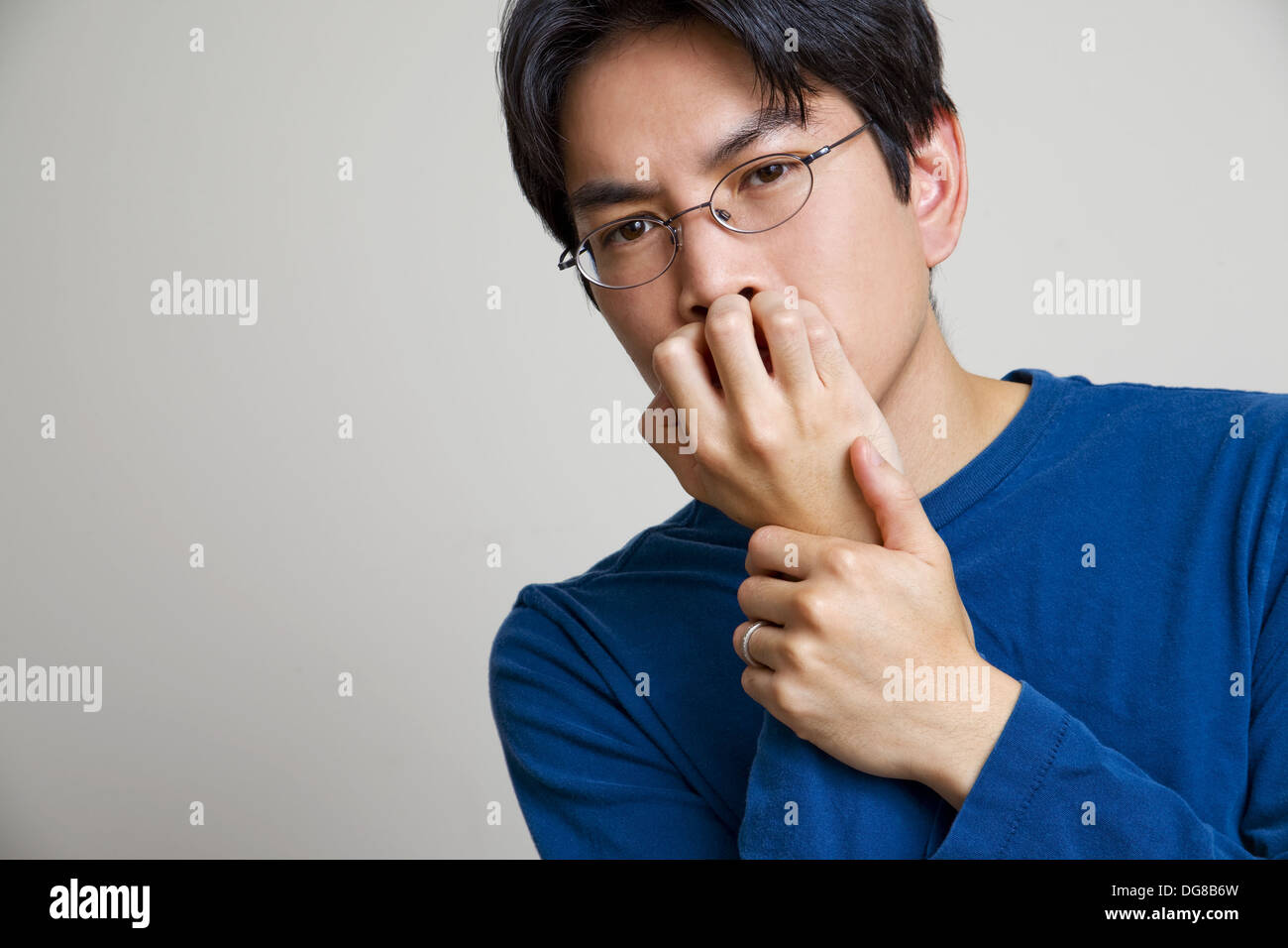 Asian man, wearing glasses, posing Stock Photo - Alamy Asian man, wearing glasses, posing Stock Photo - Alamy
