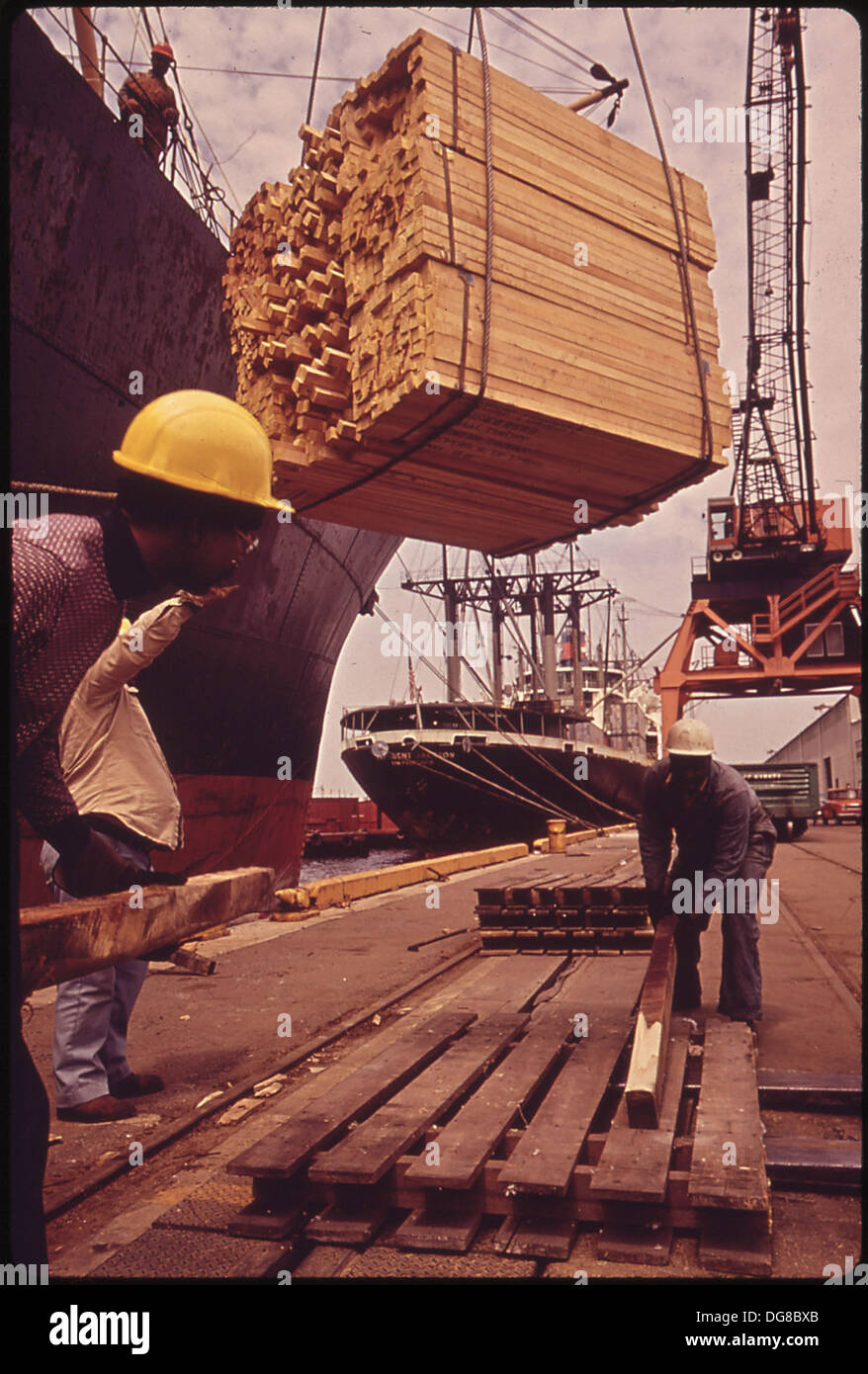 Dock workers are seen unloading cargo from a ship at the Dundalk Marine ...