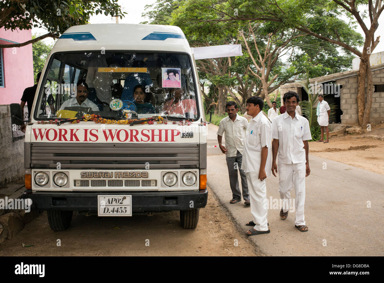 Indian staff bus arriving at a village for the Sri Sathya Sai Baba ...