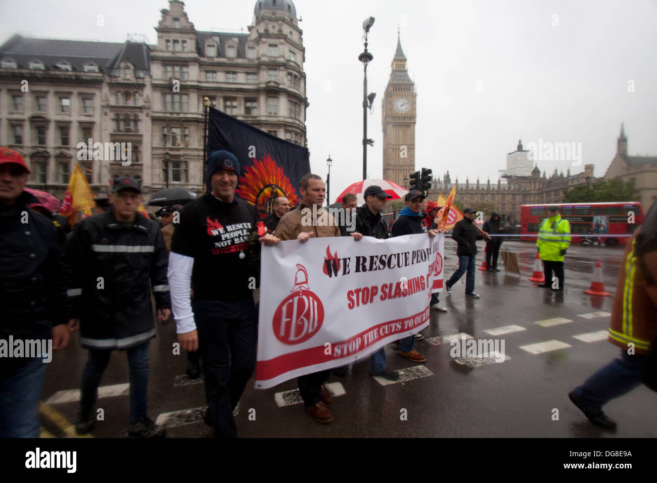 London UK. 16th October 2013. Firemen with banners and flags from the fire brigade union march ...