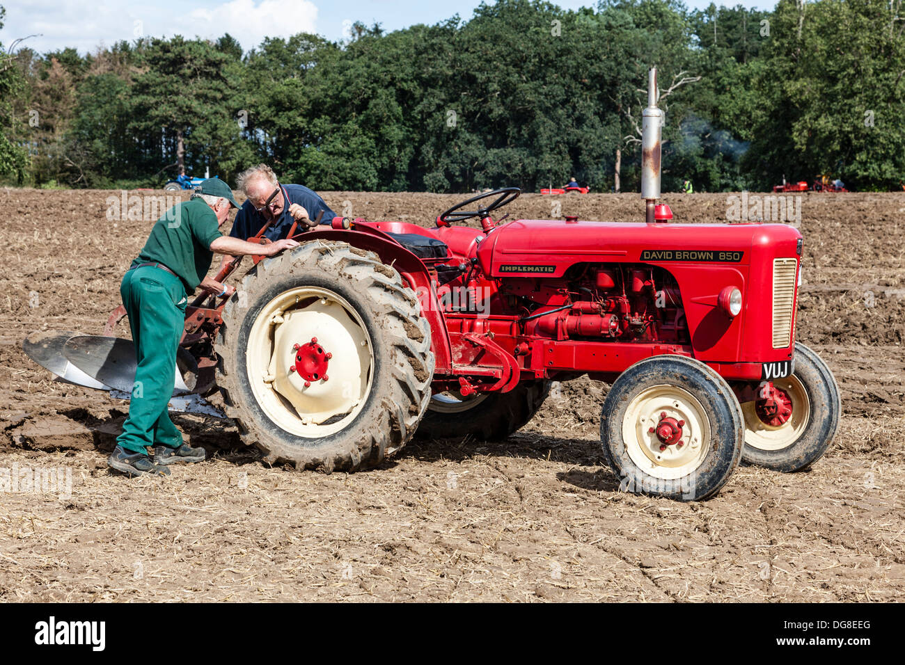 Red David Brown tractor with plough attachment Stock Photo - Alamy