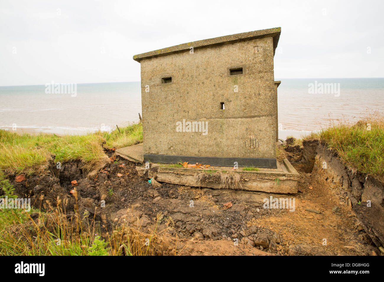 A Second world War lookout post leaning alarmingly and about to tumble ...