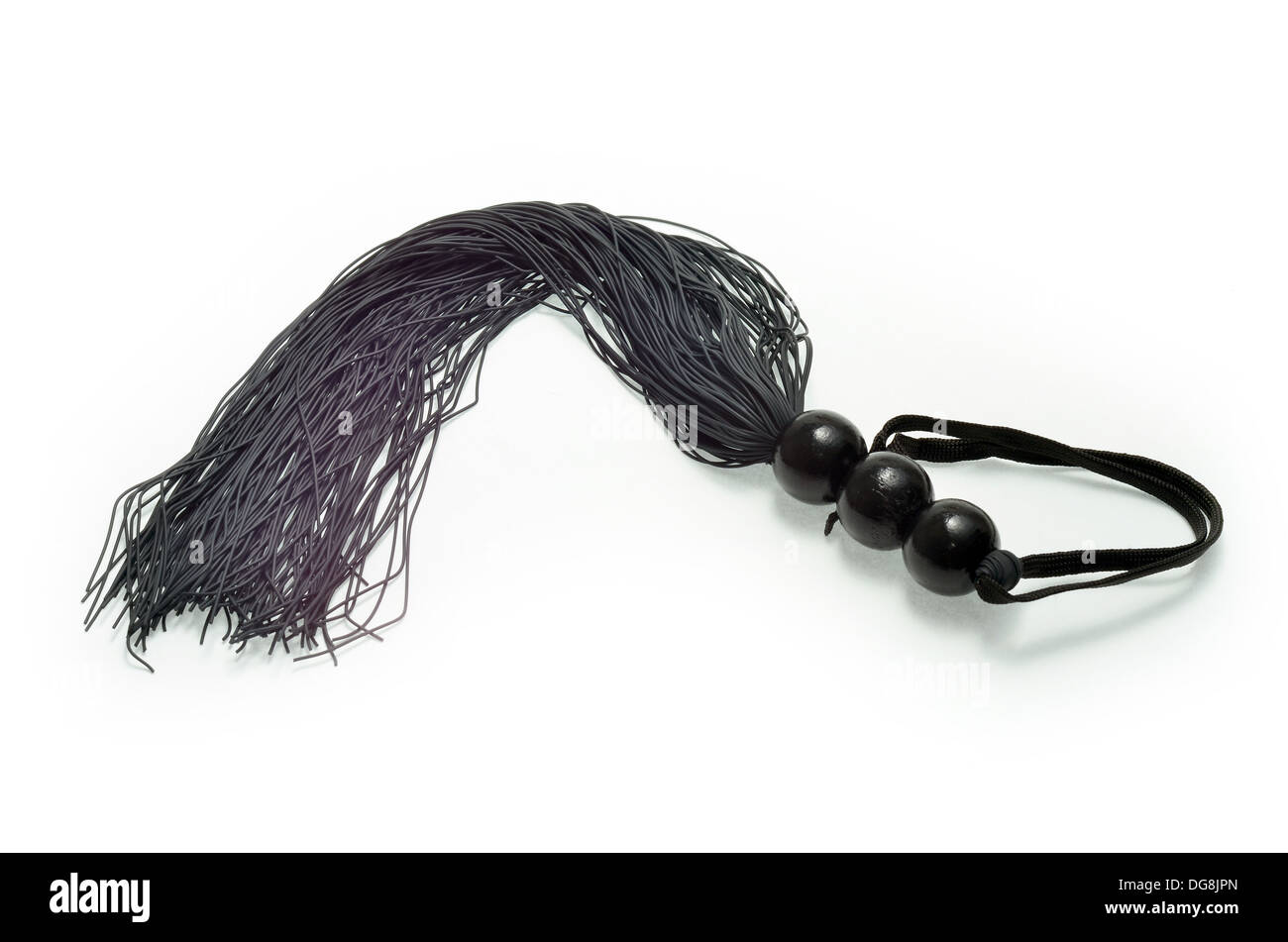 Rubber stranded flogger / whip on white background Stock Photo - Alamy