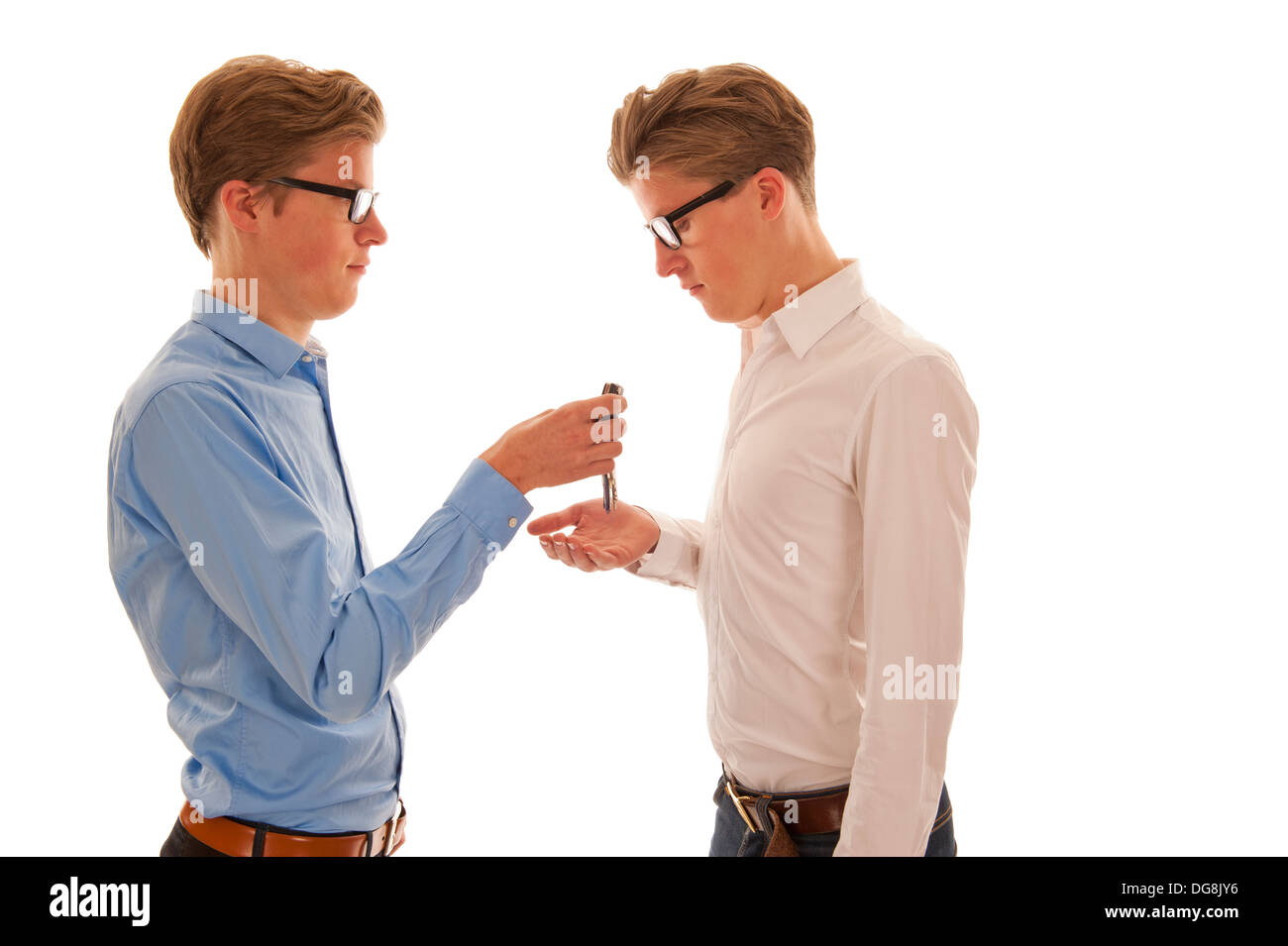 Two man transferring keys to each other isolated in white Stock Photo ...