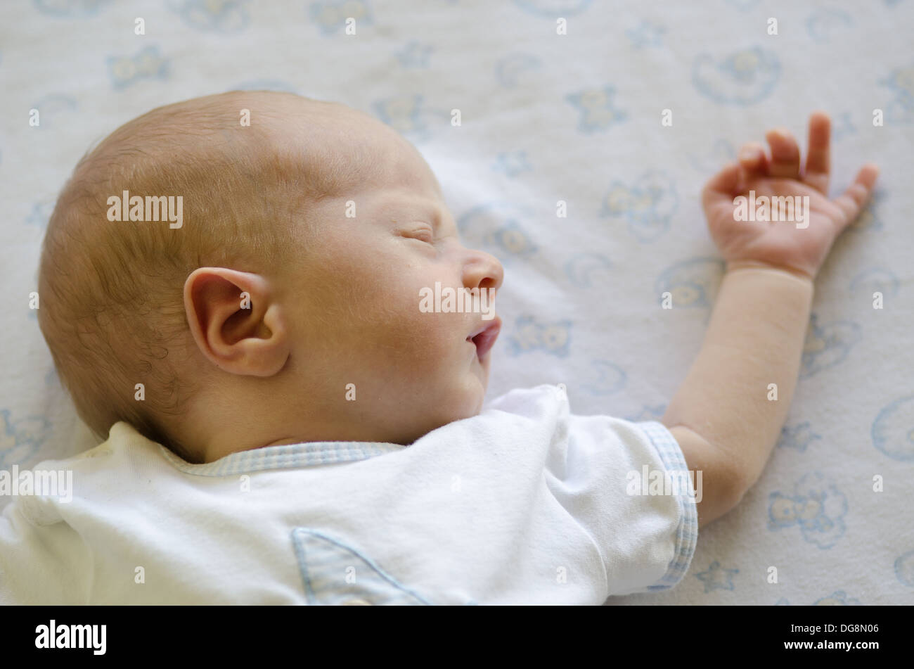 Face of a cute baby sleeping on its back and dreaming Stock Photo - Alamy
