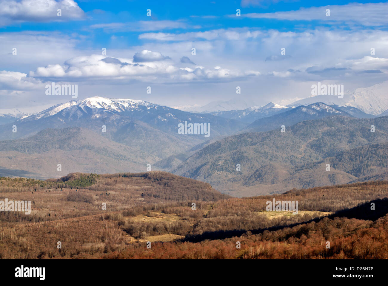 Mountain landscape with spring valley and snow peaks Stock Photo - Alamy