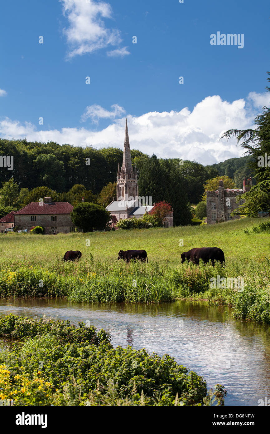 Peaceful summer village with river running in front of a chain of ...