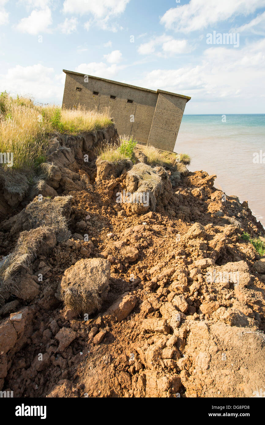 A Second world War lookout post leaning alarmingly and about to tumble ...