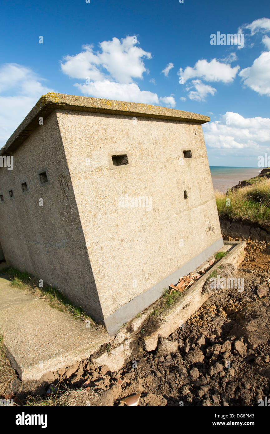 A Second world War lookout post leaning alarmingly and about to tumble ...