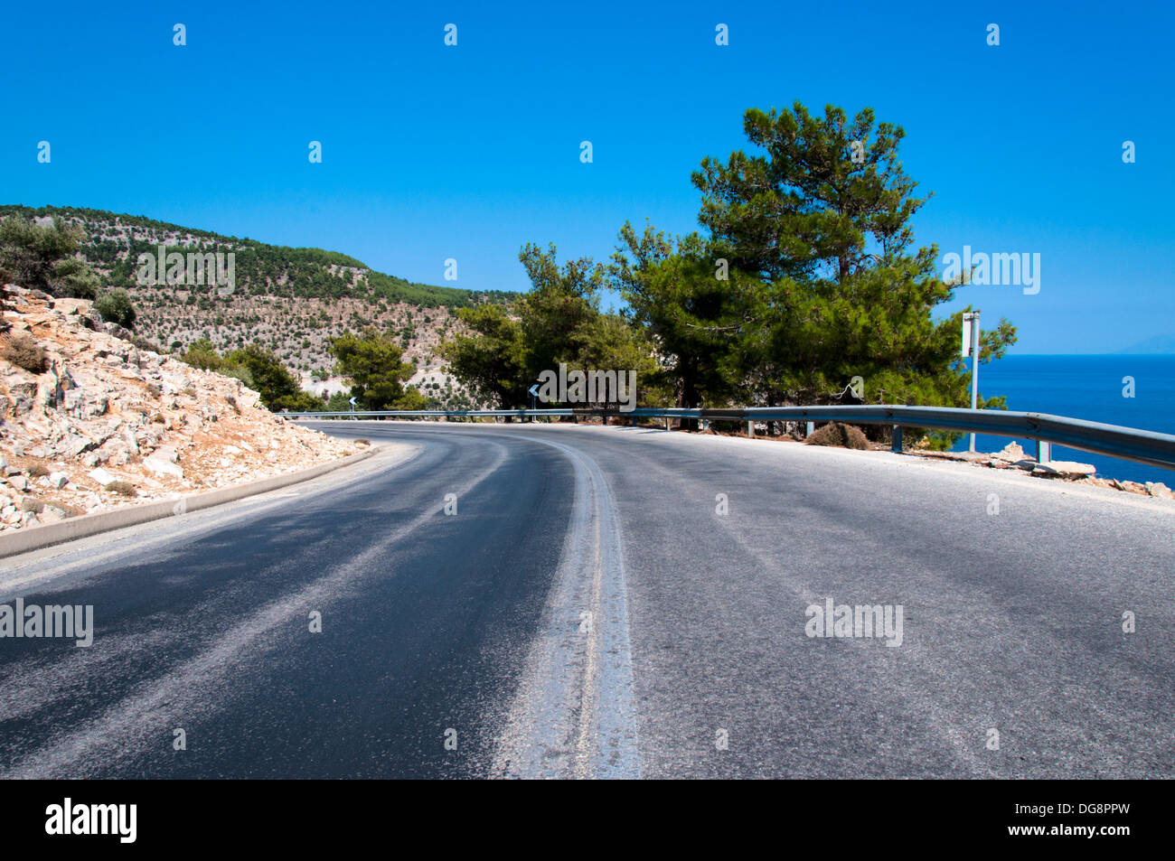 View of the road with sea on right side Stock Photo - Alamy