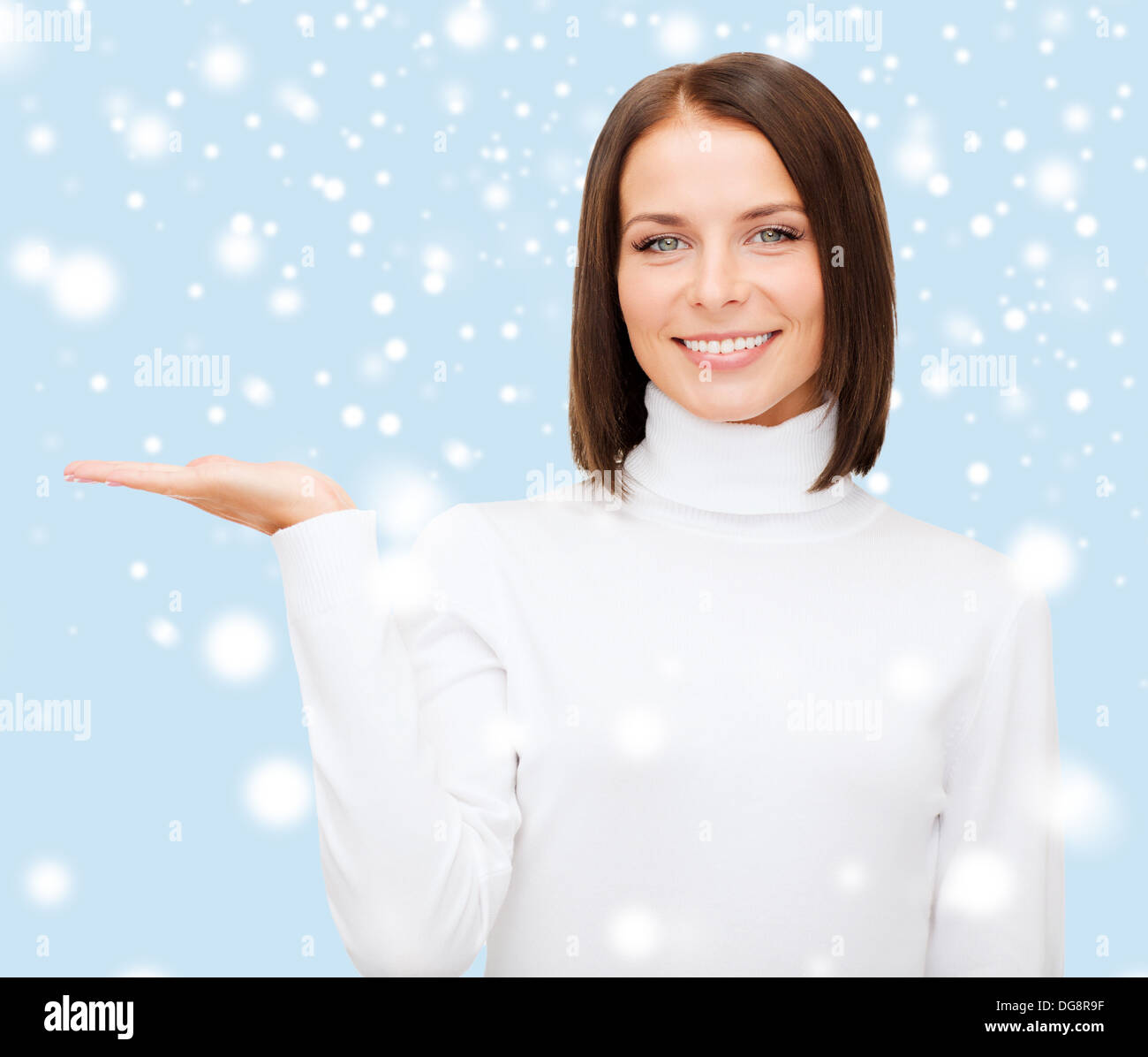 woman in white sweater with something on palm Stock Photo - Alamy