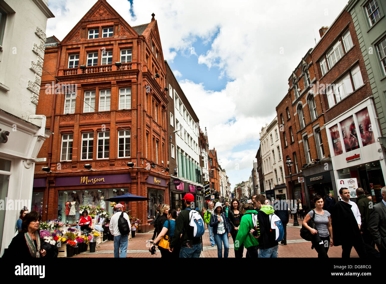 Shoppers and tourists on a busy city street in downtown Dublin, Ireland ...