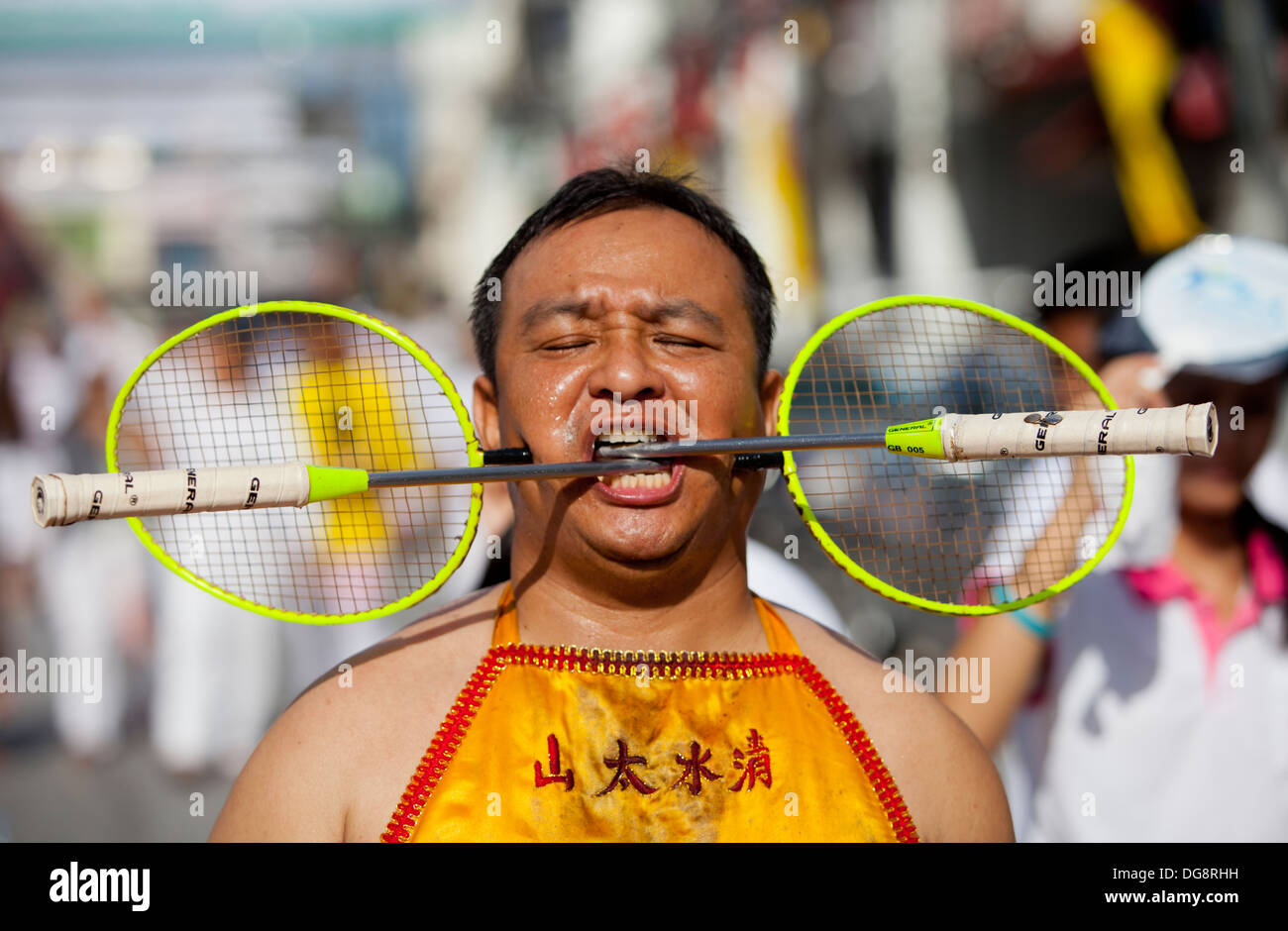 A Spirit medium walks in a street procession at the Phuket Vegetarian ...