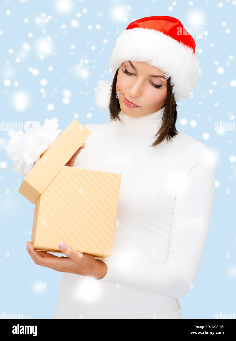 suspicious woman in santa helper hat with gift box Stock Photo - Alamy