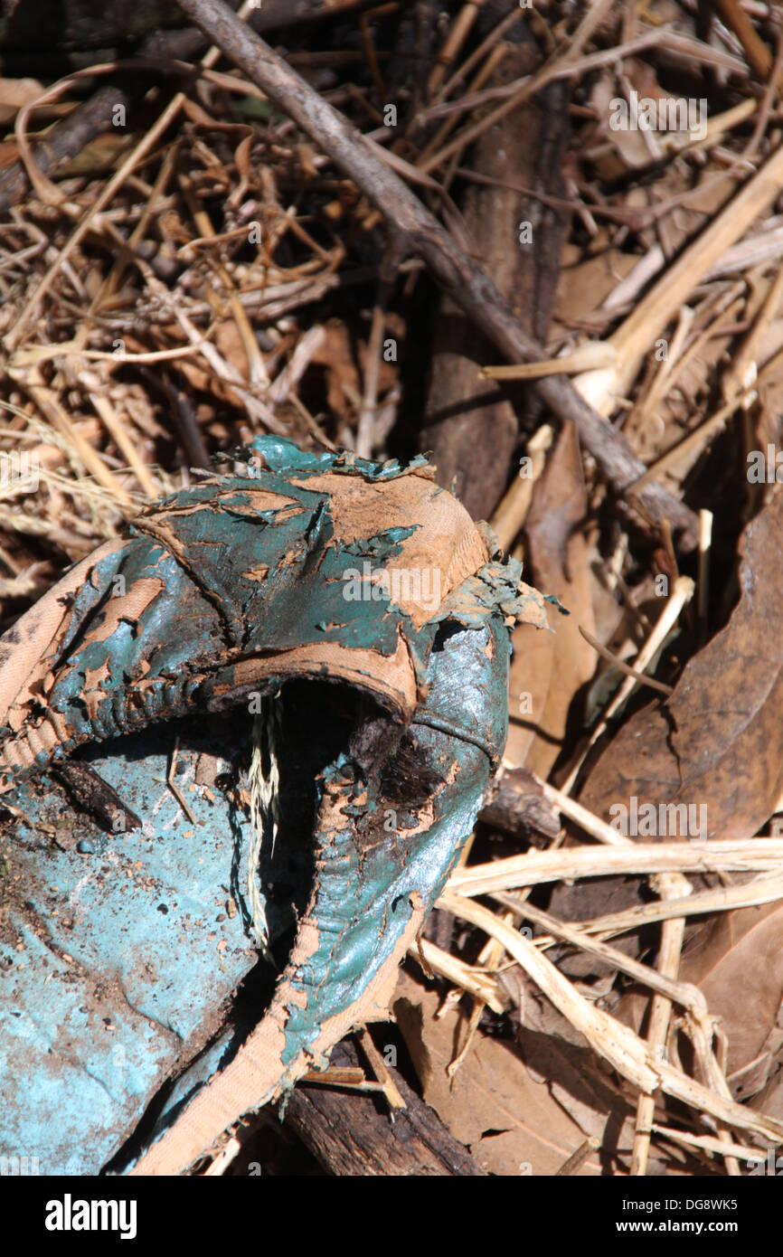 old shoe on derelict ground Stock Photo - Alamy