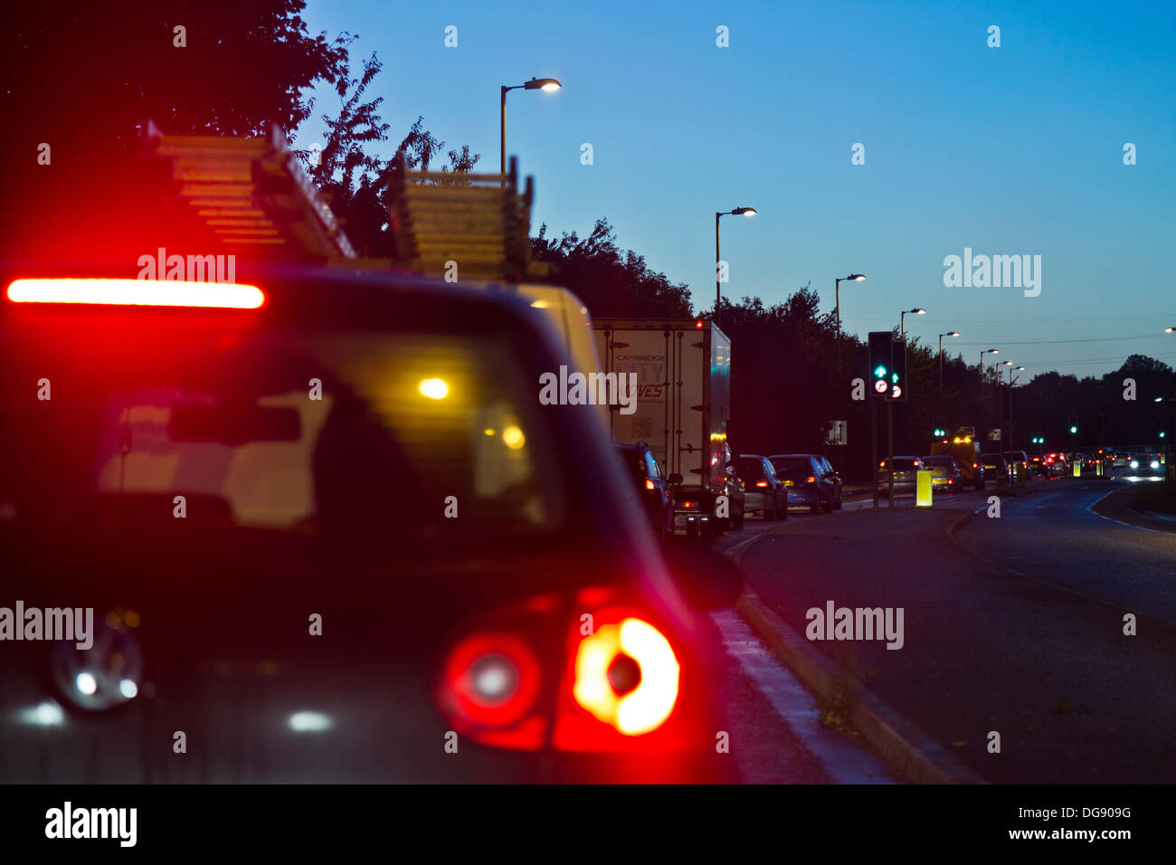 Queuing road traffic at green traffic lights, Cambridge, England Stock ...
