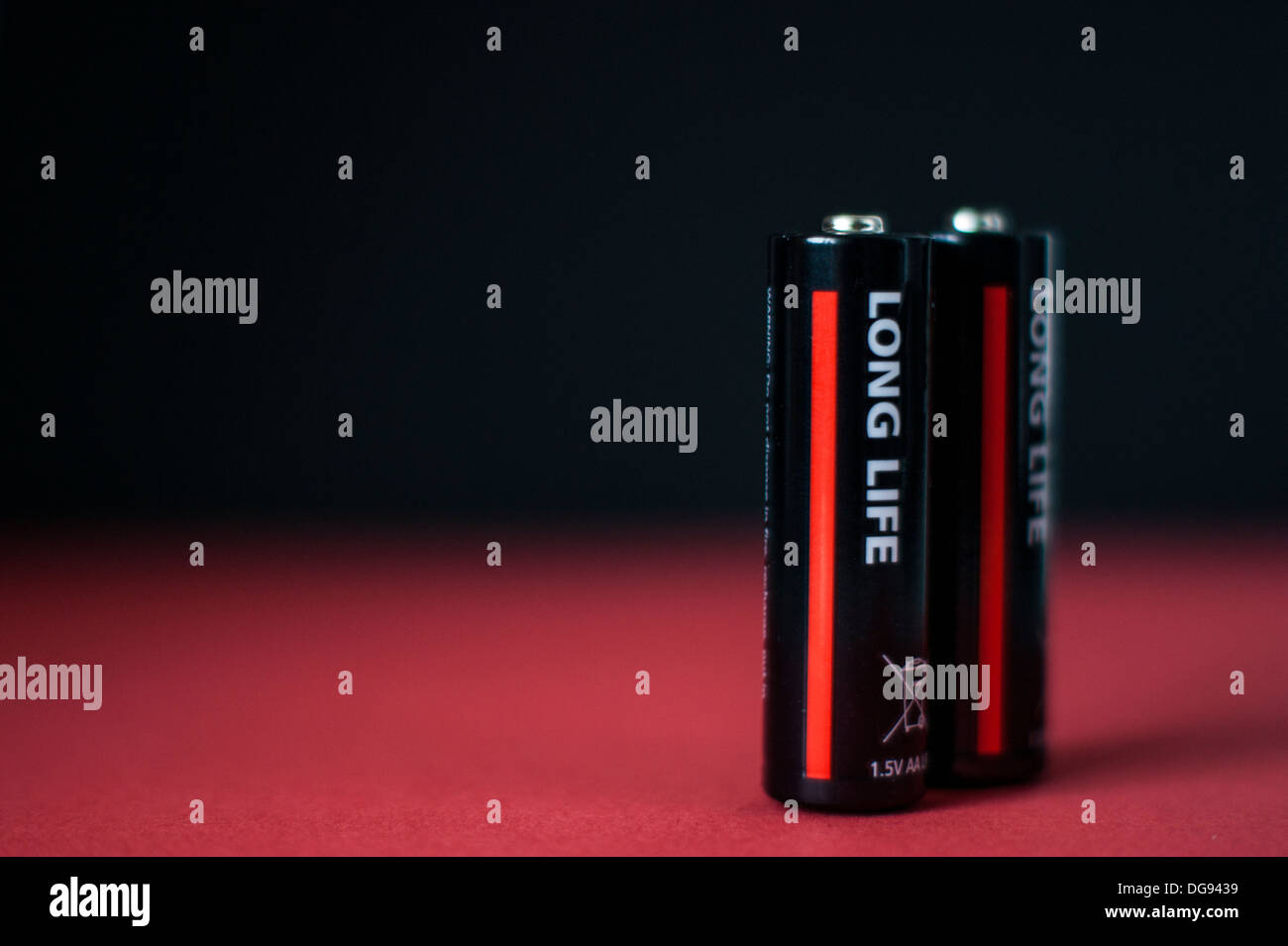 Batteries on Black and Red Stock Photo - Alamy