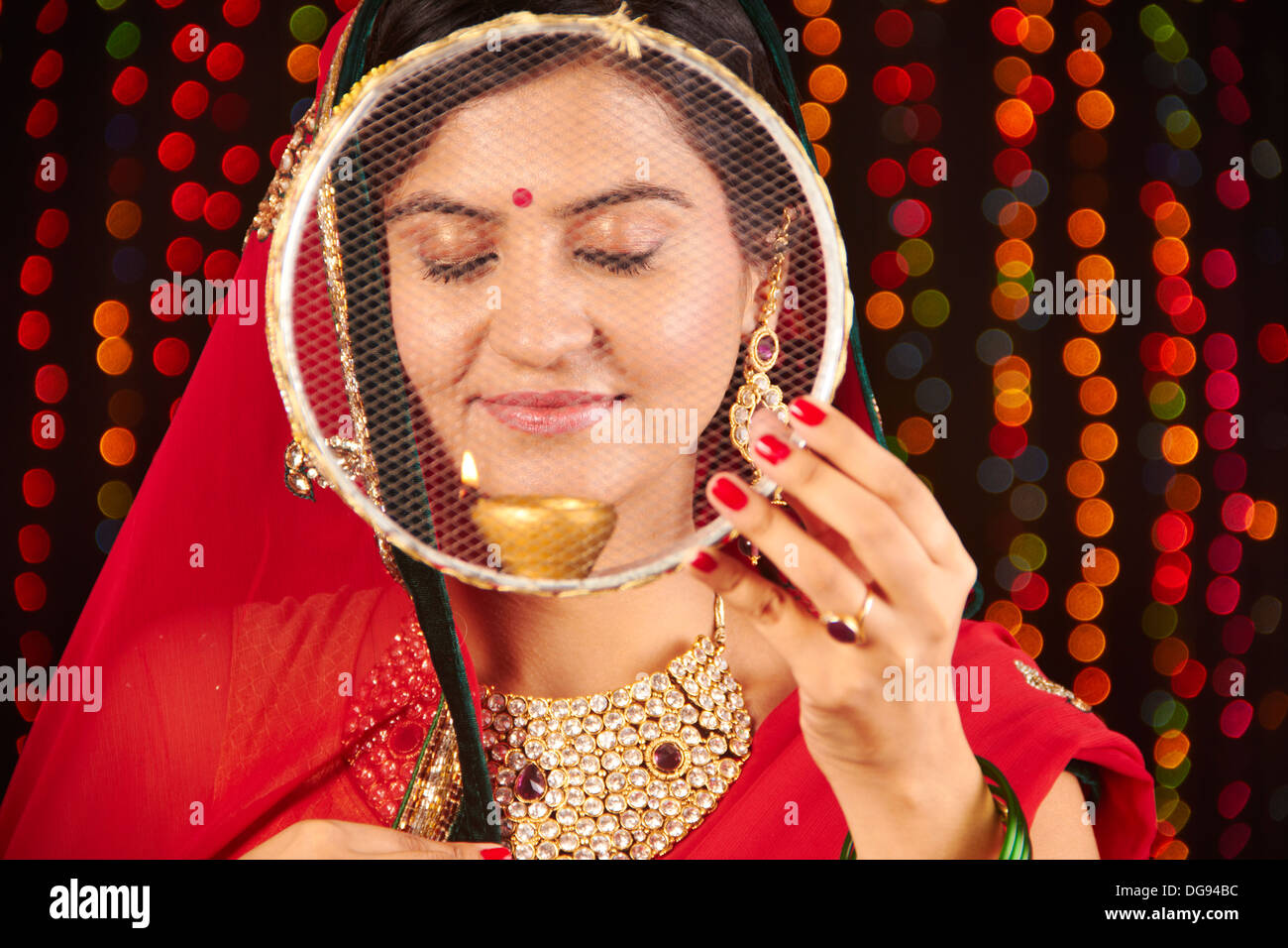 Indian woman on doing pooja hi-res stock photography and images - Alamy