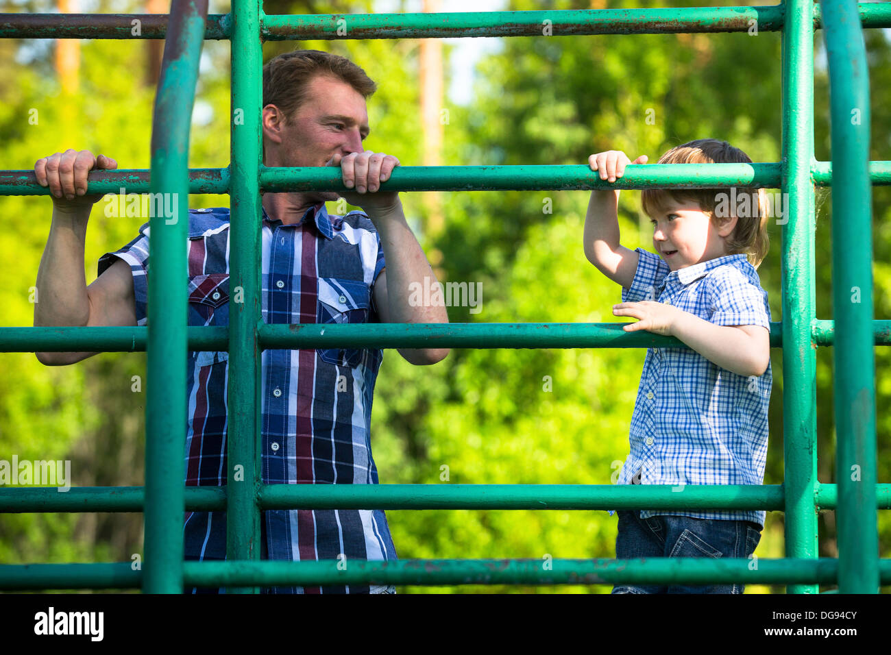 Father and son playing on the park playground Stock Photo - Alamy