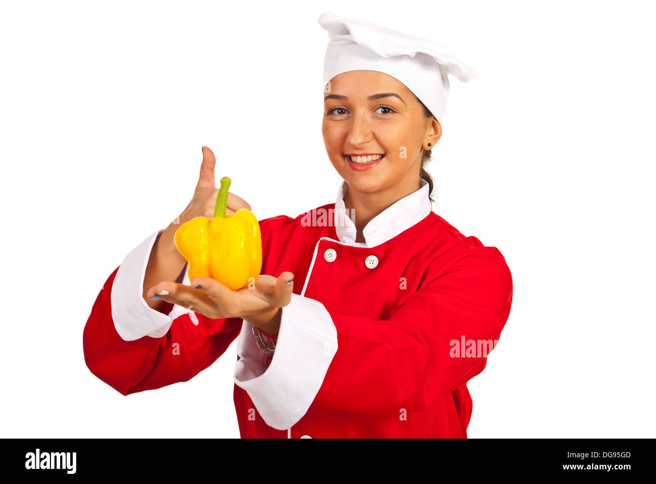 Chef woman holding yellow bell pepper and giving thumb up isolated on ...