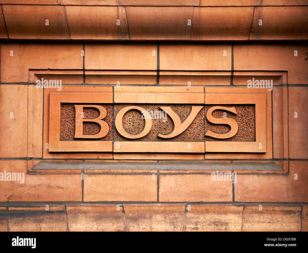 Boys sign above council school entrance build in wall UK Stock Photo ...
