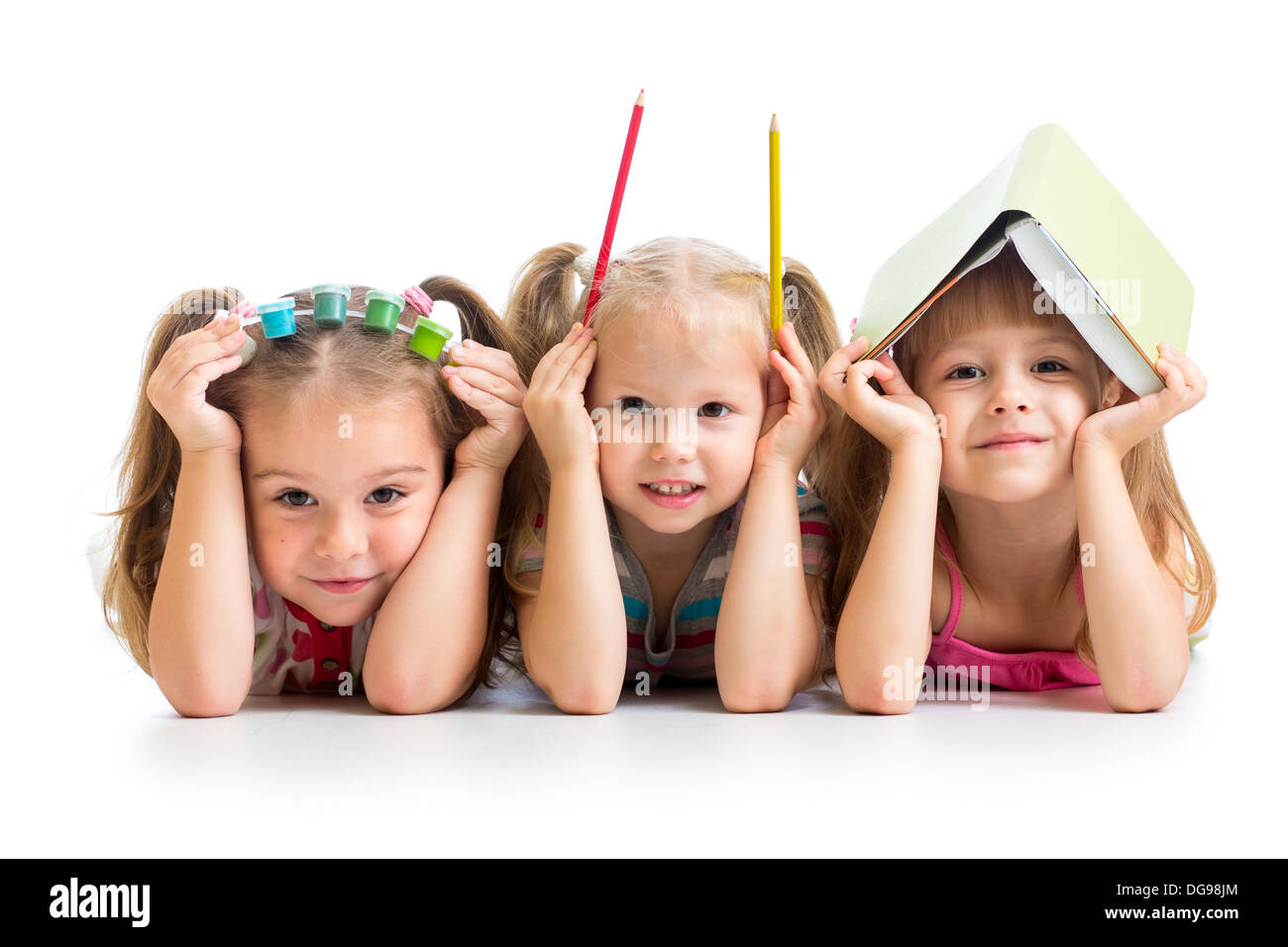 kids with book, pencils and paints on their heads Stock Photo - Alamy