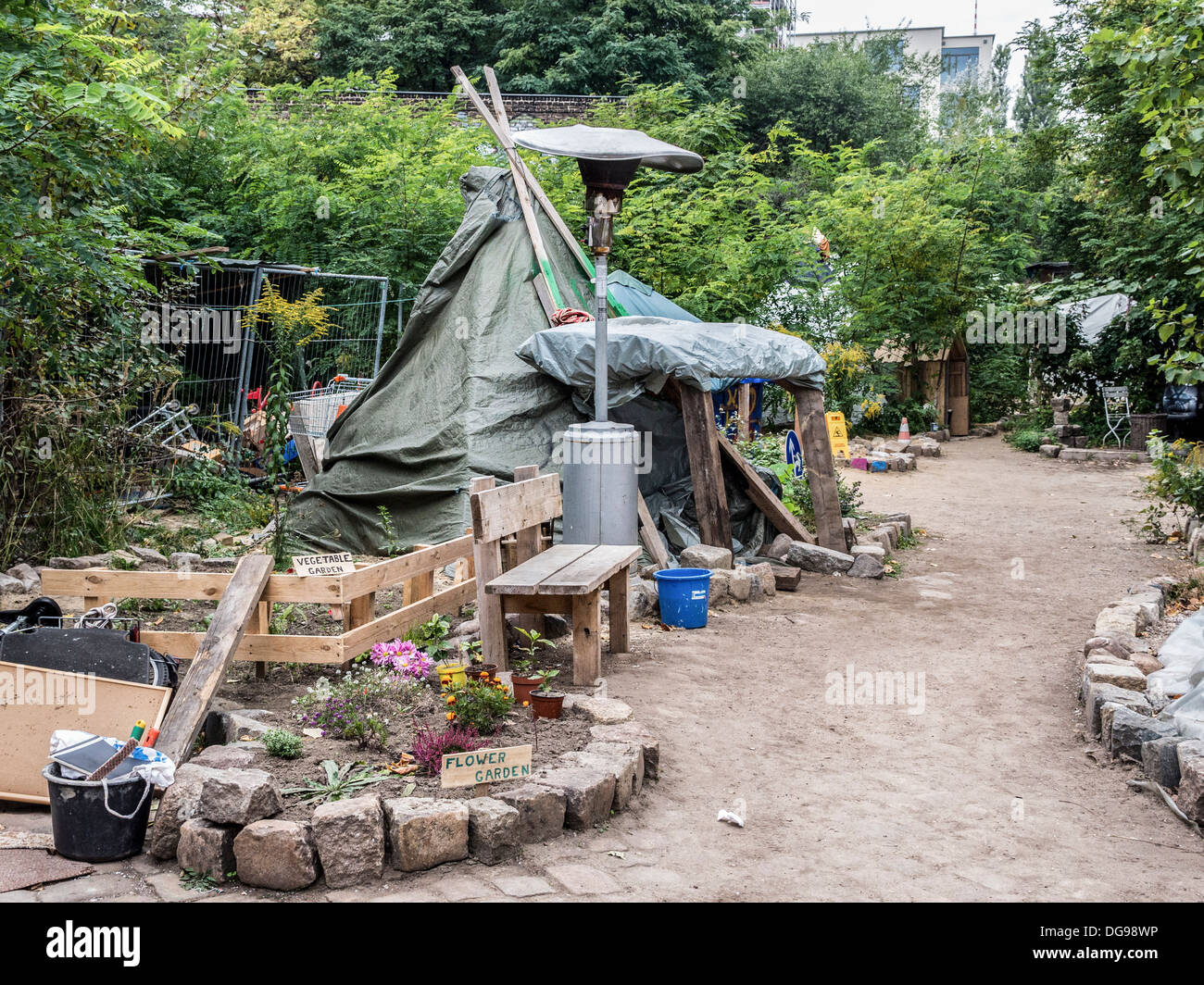 Squatters set up informal tented community using recycled materials to ...