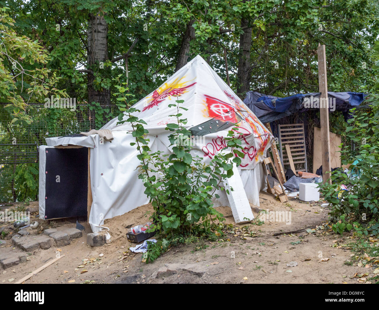 Squatters set up informal tented community using recycled materials to ...