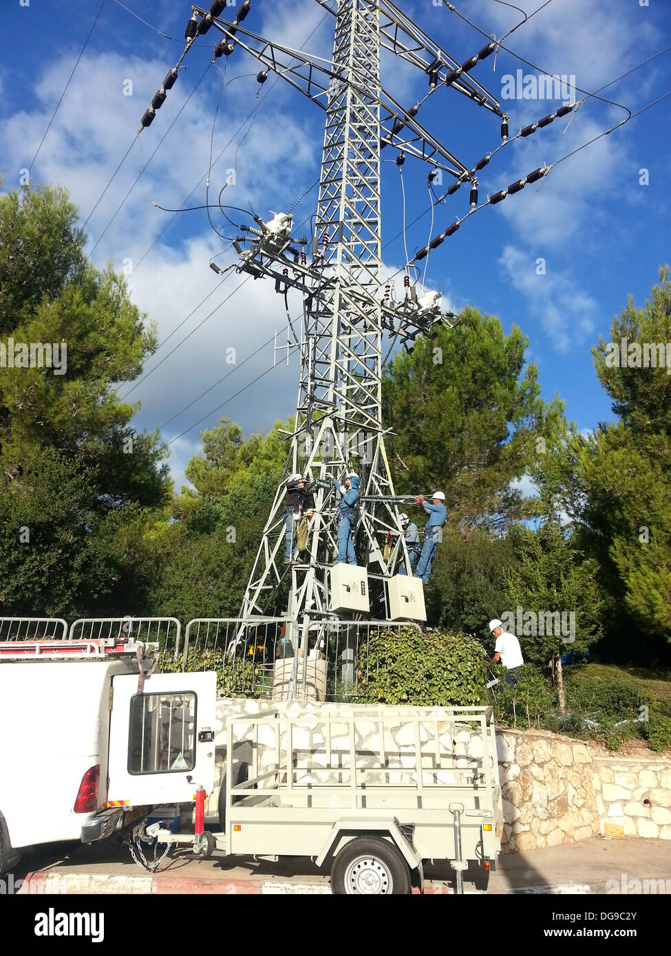 Electricians work on a high voltage pylon Photographed in Israel Stock ...