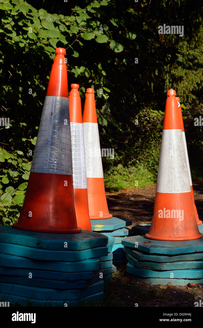 Stack of road cones or traffic cones stored or abandoned in a quiet ...