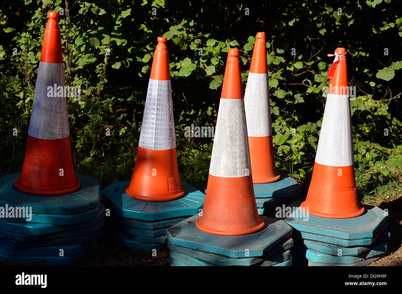 Stack of road cones or traffic cones stored or abandoned in a quiet ...