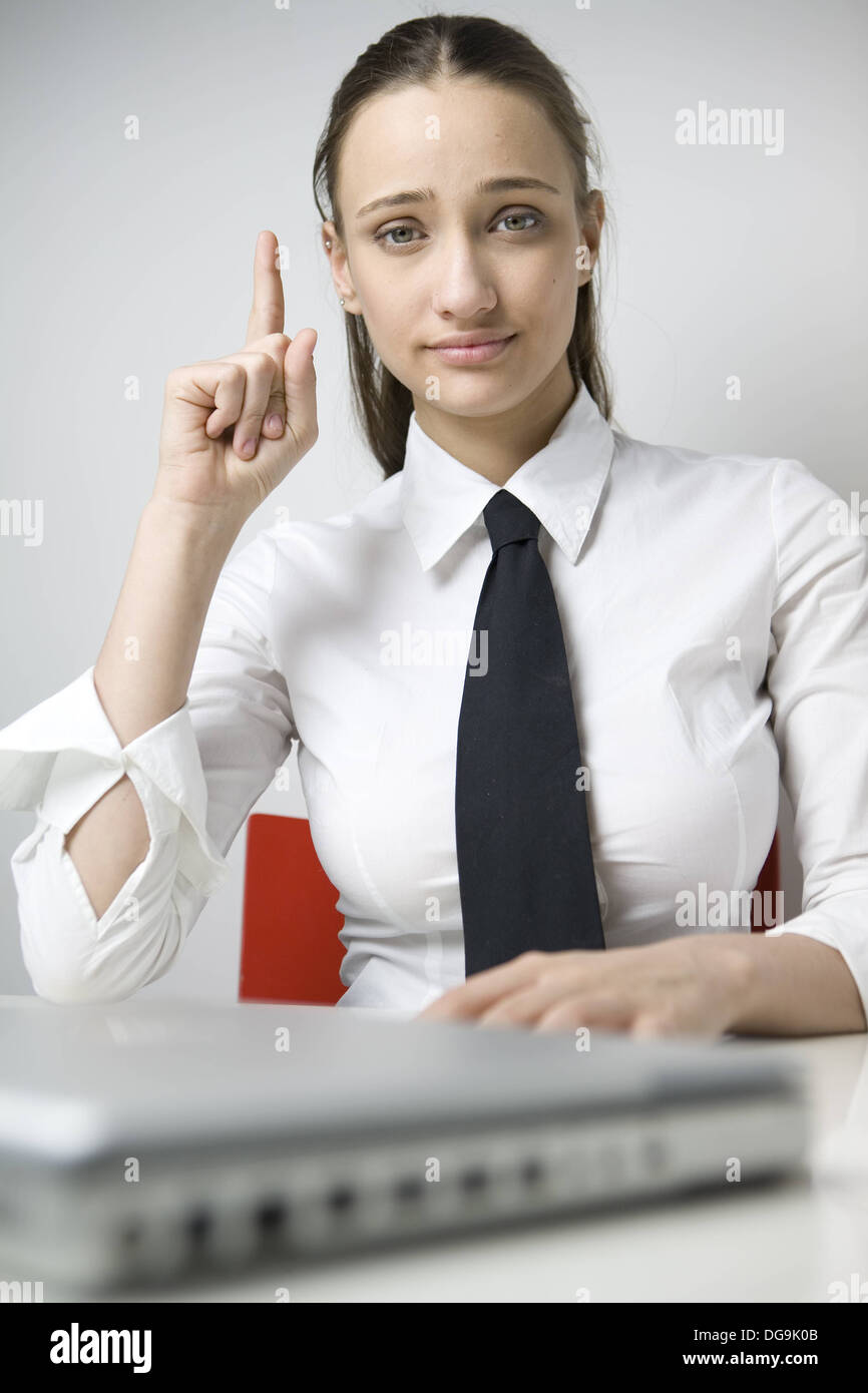 Woman raising finger question hi-res stock photography and images - Alamy