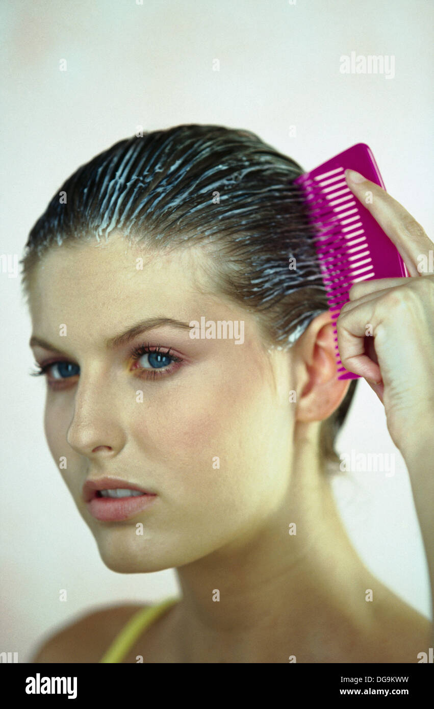 Hair cream woman combing hi-res stock photography and images - Alamy