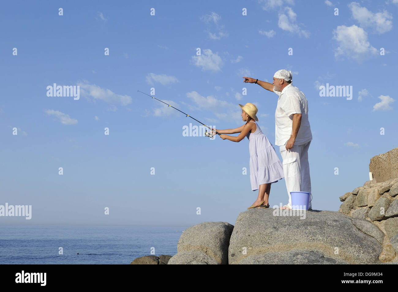 Grandpa and granddaughter fishing hi-res stock photography and images ...