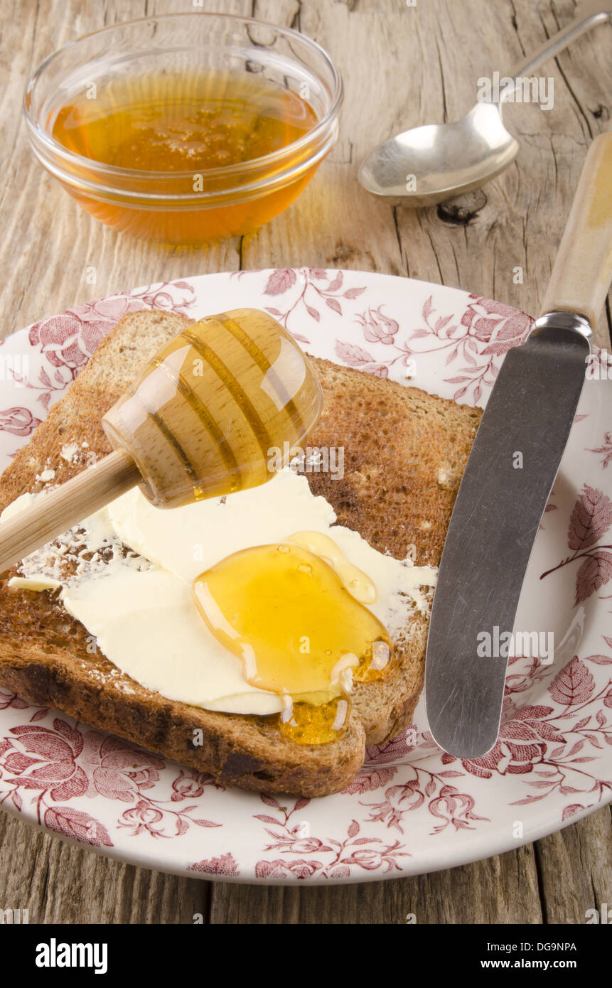 Honey dipper on toast hi-res stock photography and images - Alamy
