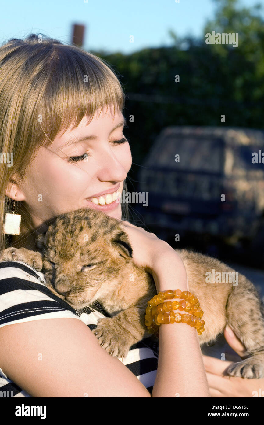 Young girl lion cub hi-res stock photography and images - Alamy