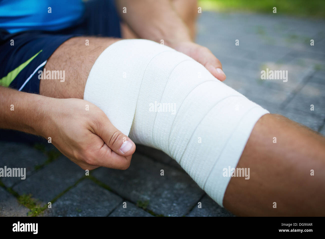 Bandaging leg hi-res stock photography and images - Alamy