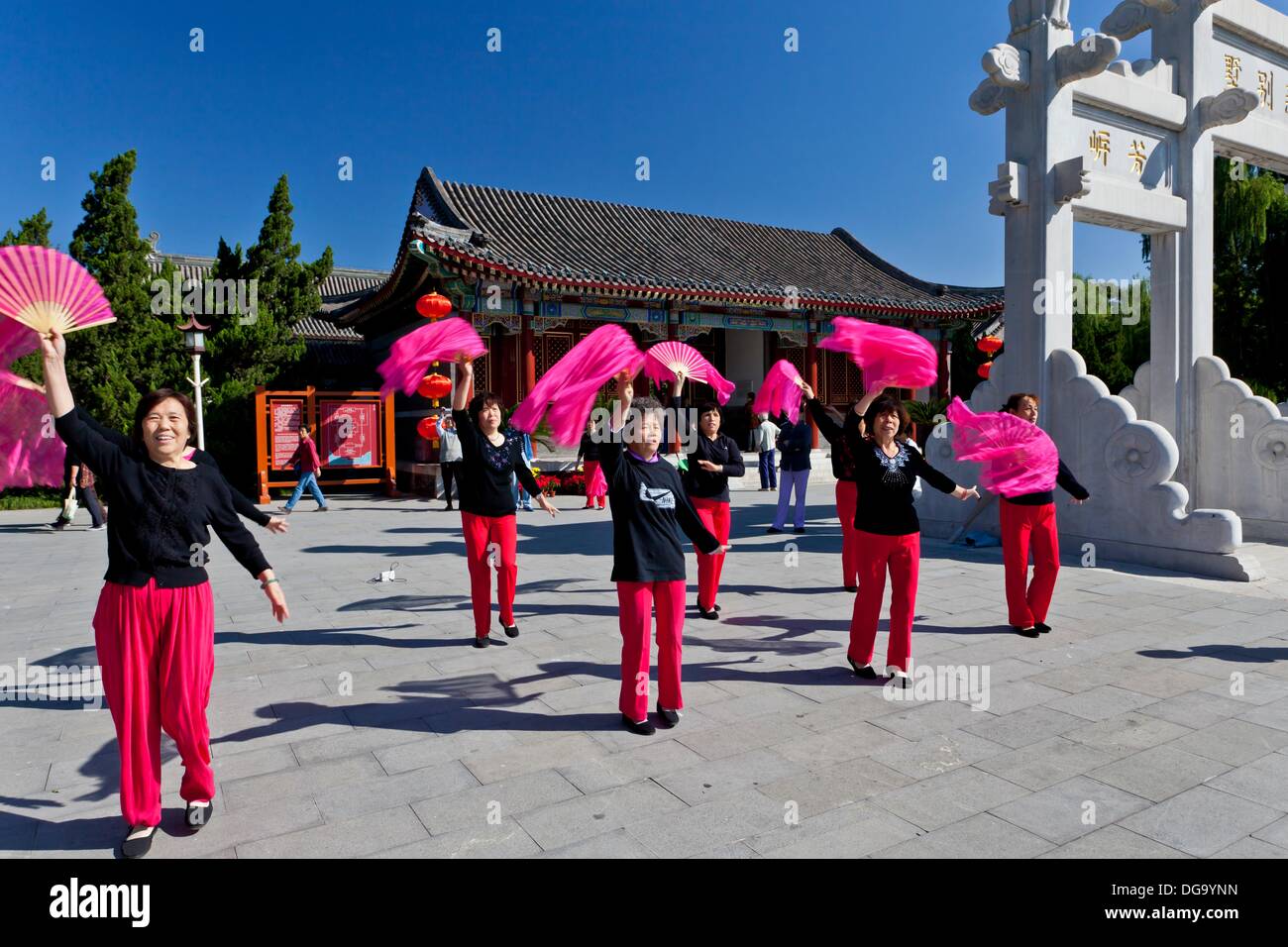 A colorful ladies dance group rehearsing in Grandview Park, Beijing ...