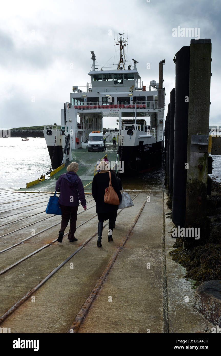Passengers boarding the Caledonian MacBrayne Car Ferry MV Loch Portain ...