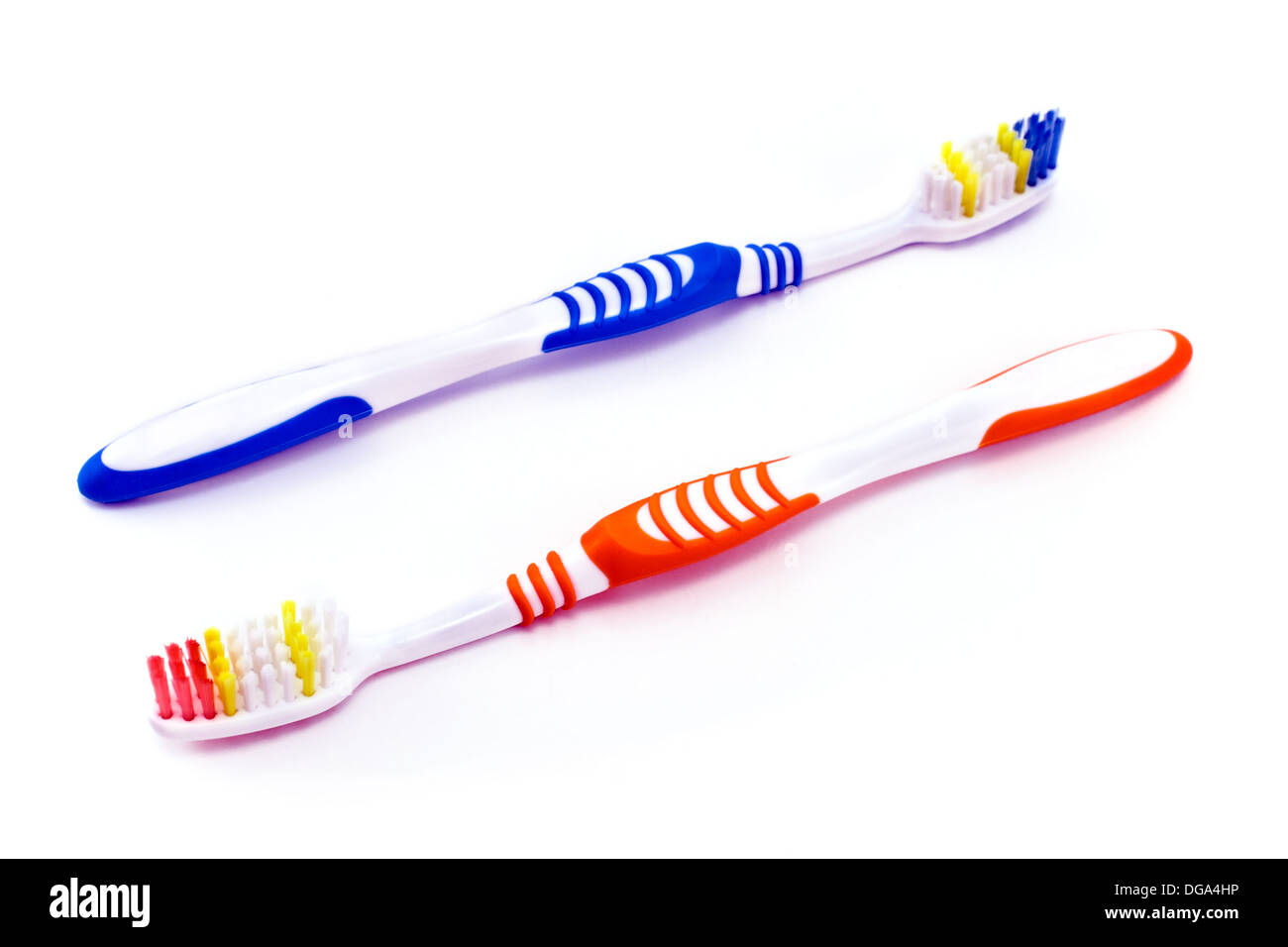 Two colorful toothbrushes isolated on white background Stock Photo - Alamy