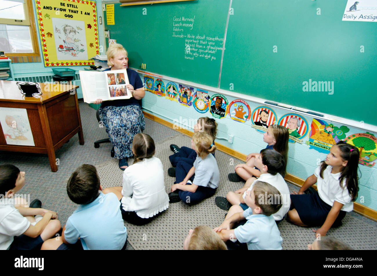 Teacher in religious class training in a Catholic elementary school ...