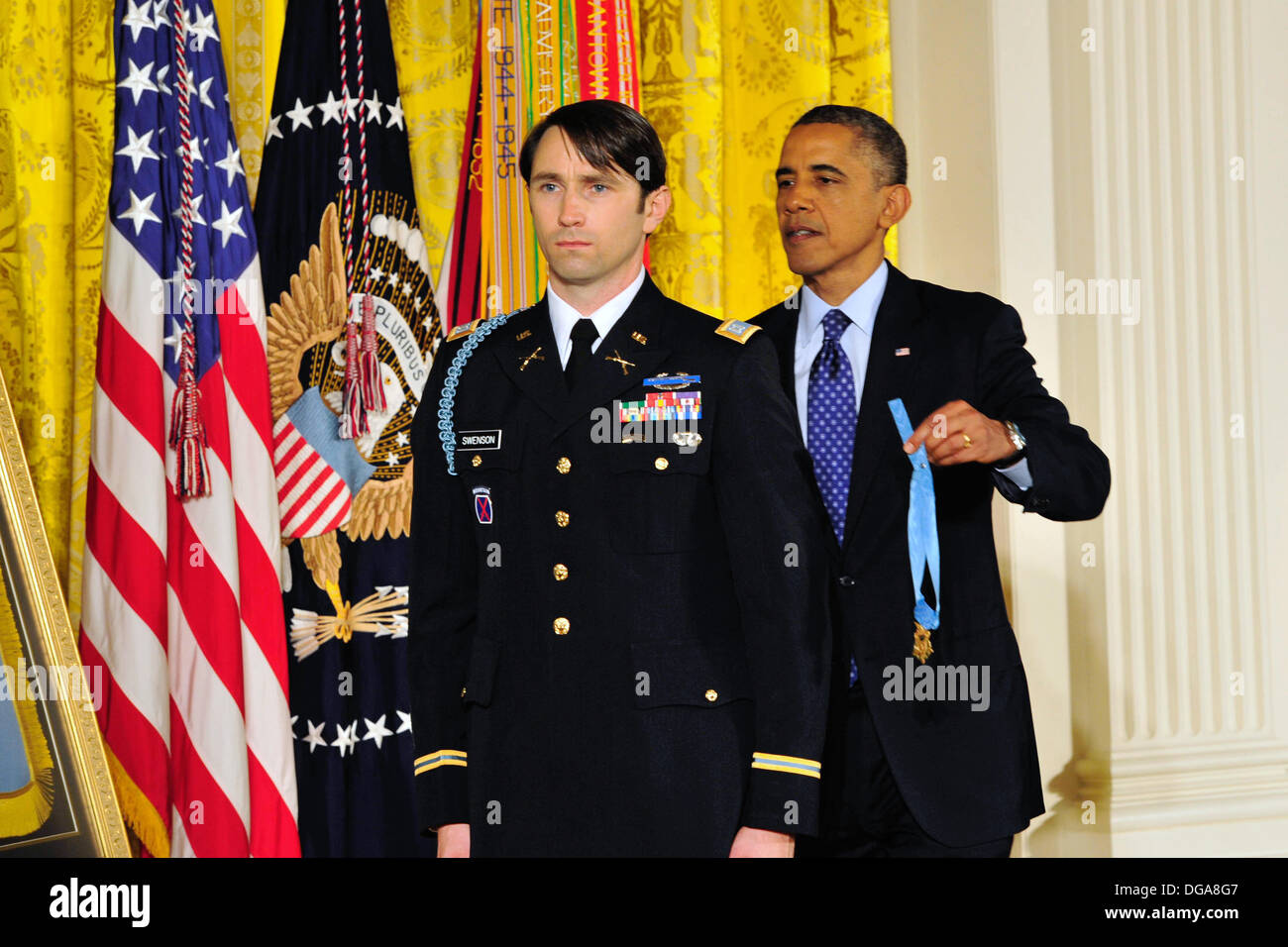 US President Barack Obama presents former US Army Capt. William D ...