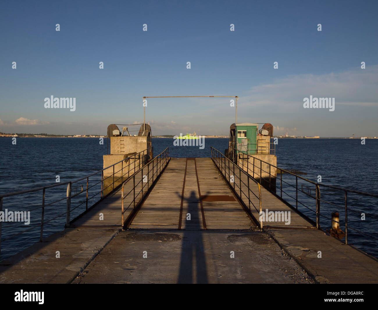 Green ferry boat in front of wharf Stock Photo - Alamy