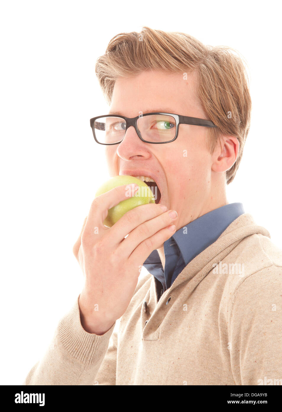 Young man eating an apple isolated on white background Stock Photo - Alamy
